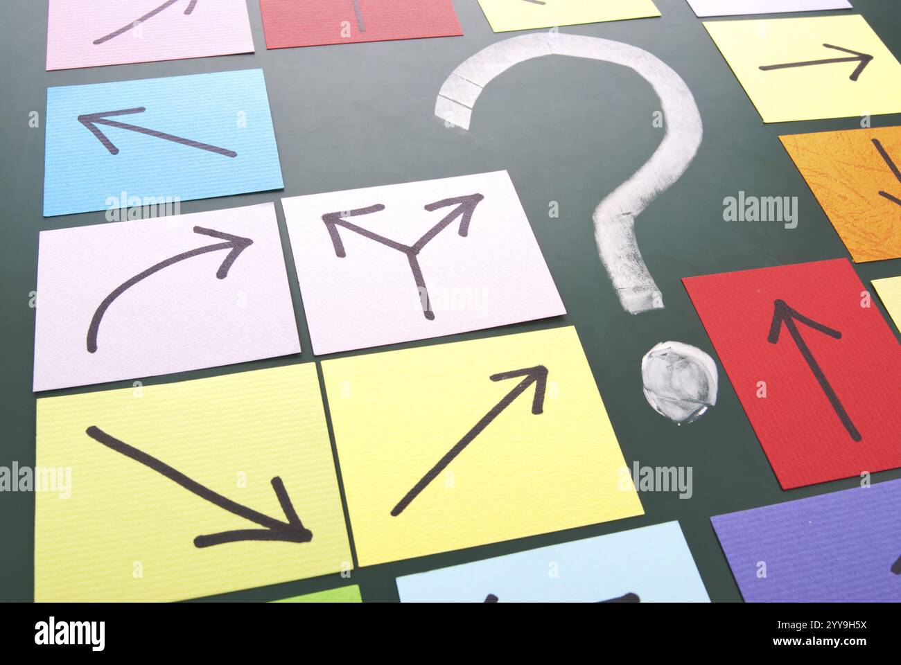 Question mark and colorful paper with different direction Stock Photo ...