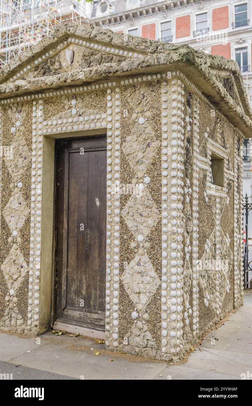 Small historic building decorated with stone and shell patterns in an ...
