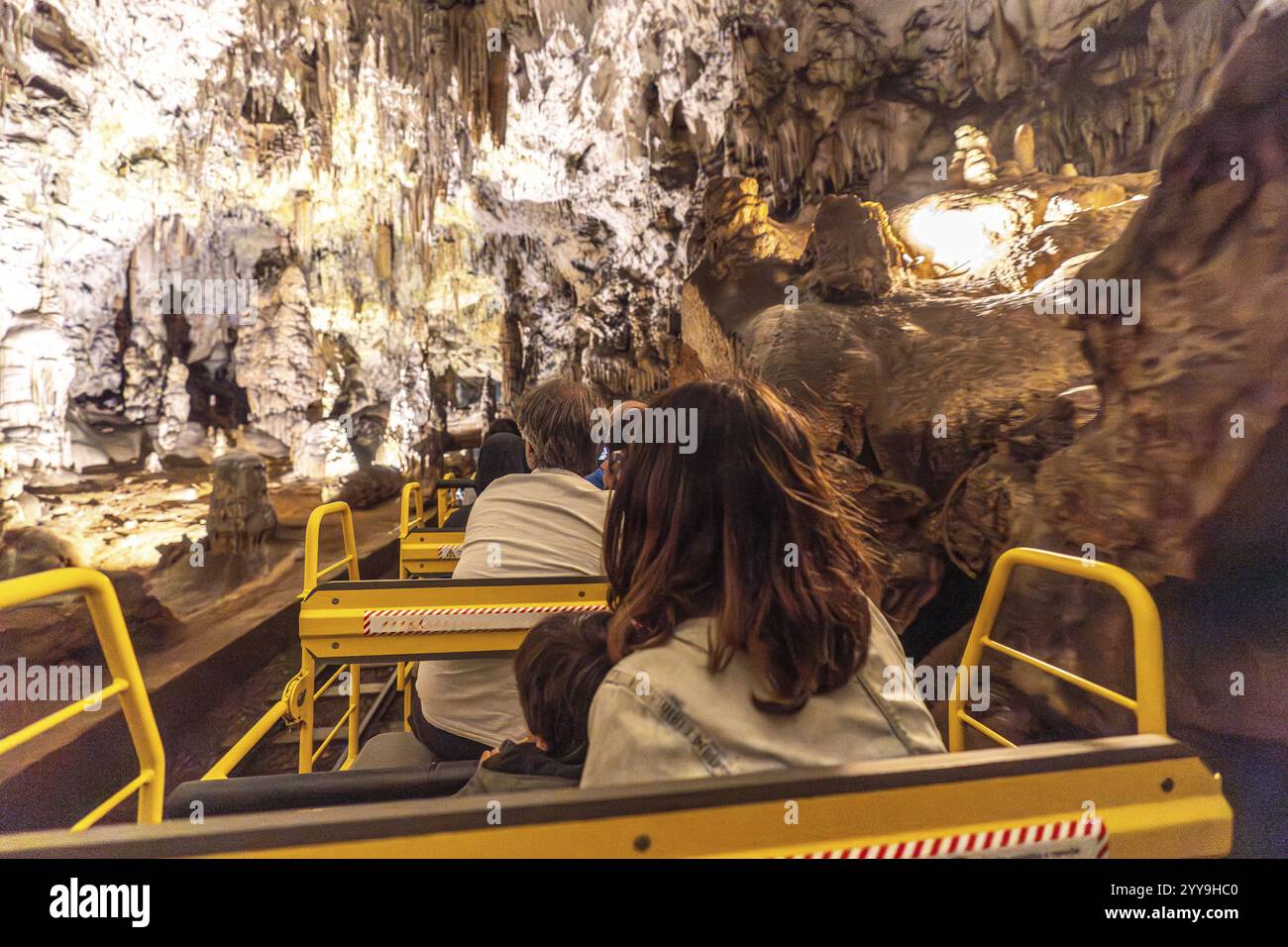 Tourists enjoying a train ride through the magnificent formations of ...