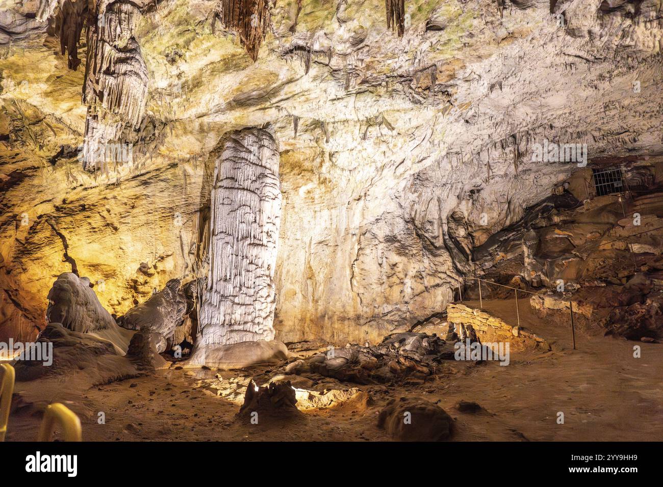 Stalagmites and stalactites creating a brilliant column inside postojna ...
