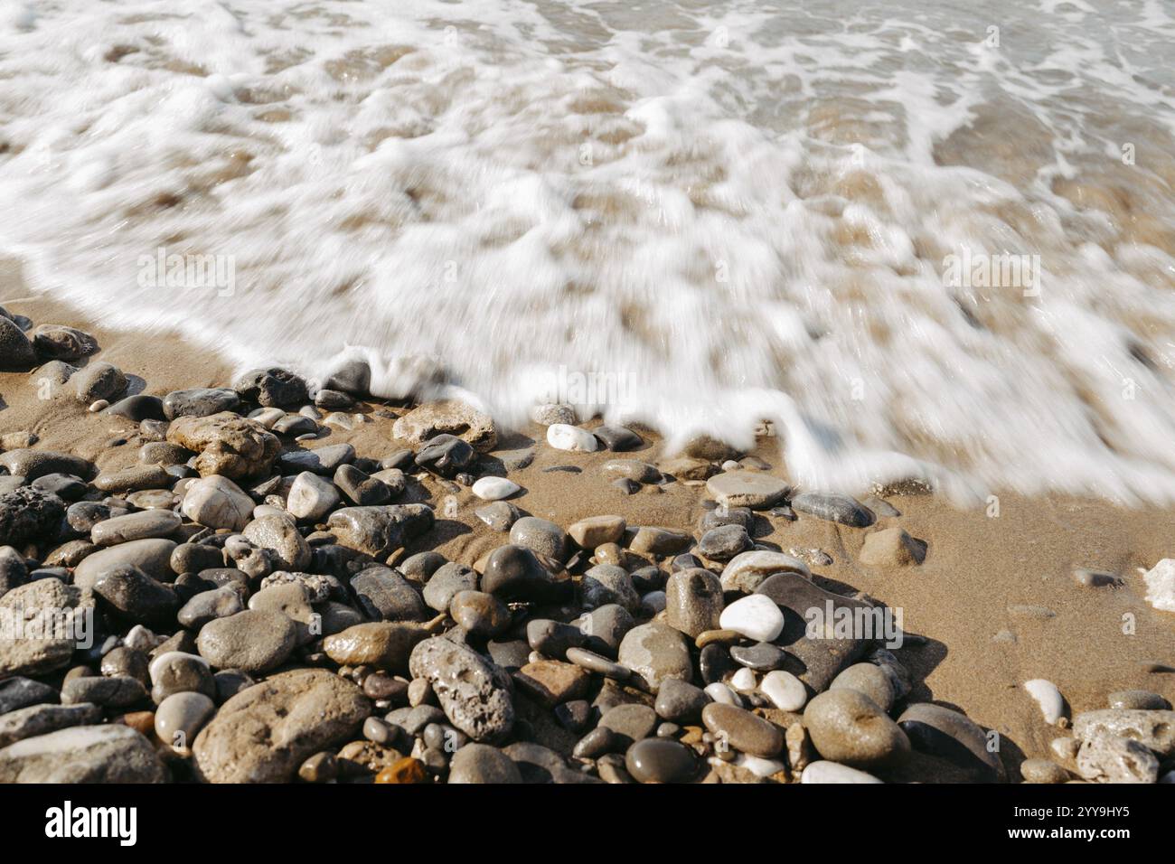 Seashore on the pebble beach Stock Photo - Alamy