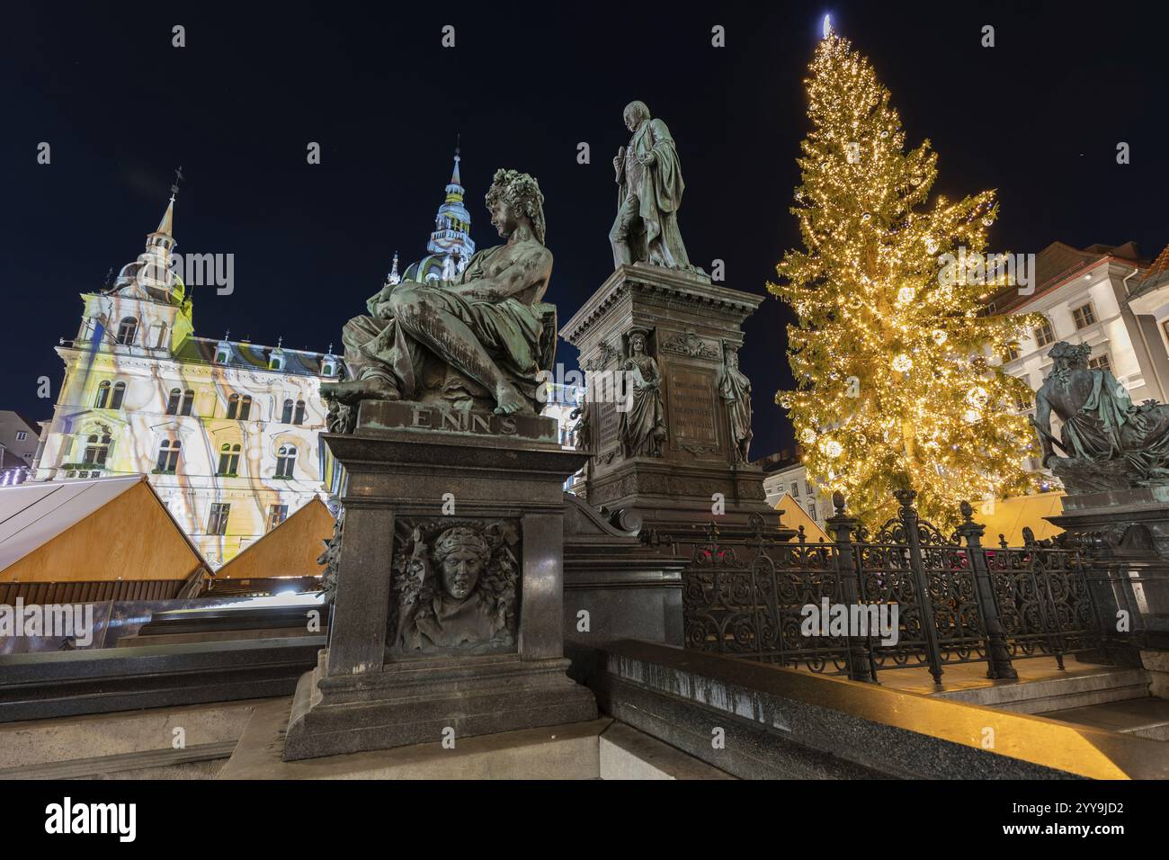 Illuminated Christmas tree, town hall, fountain with monument to ...