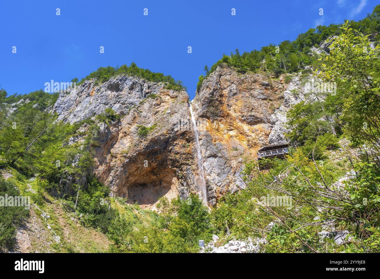 Majestic rinka waterfall flows through rocky cliffs in logarska dolina ...
