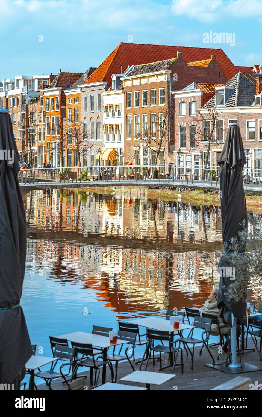a waterfront terrace bar with canal house in the background, Utrecht ...