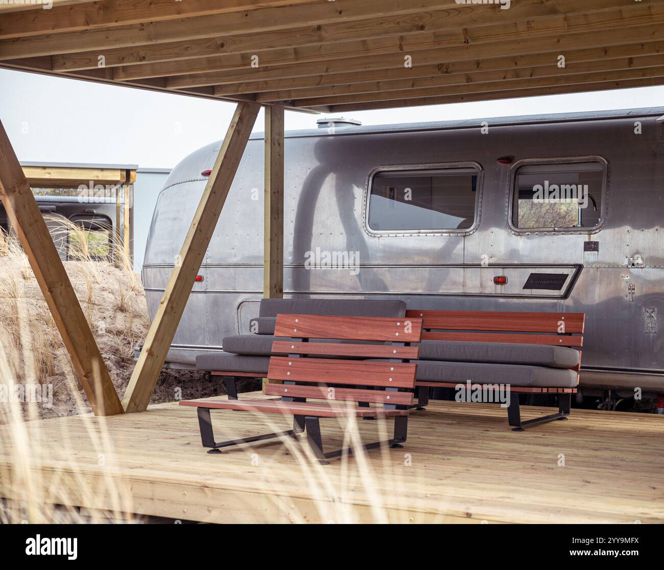 Vintage Airstream camping car with terrace, luxury camping lifestyle ...