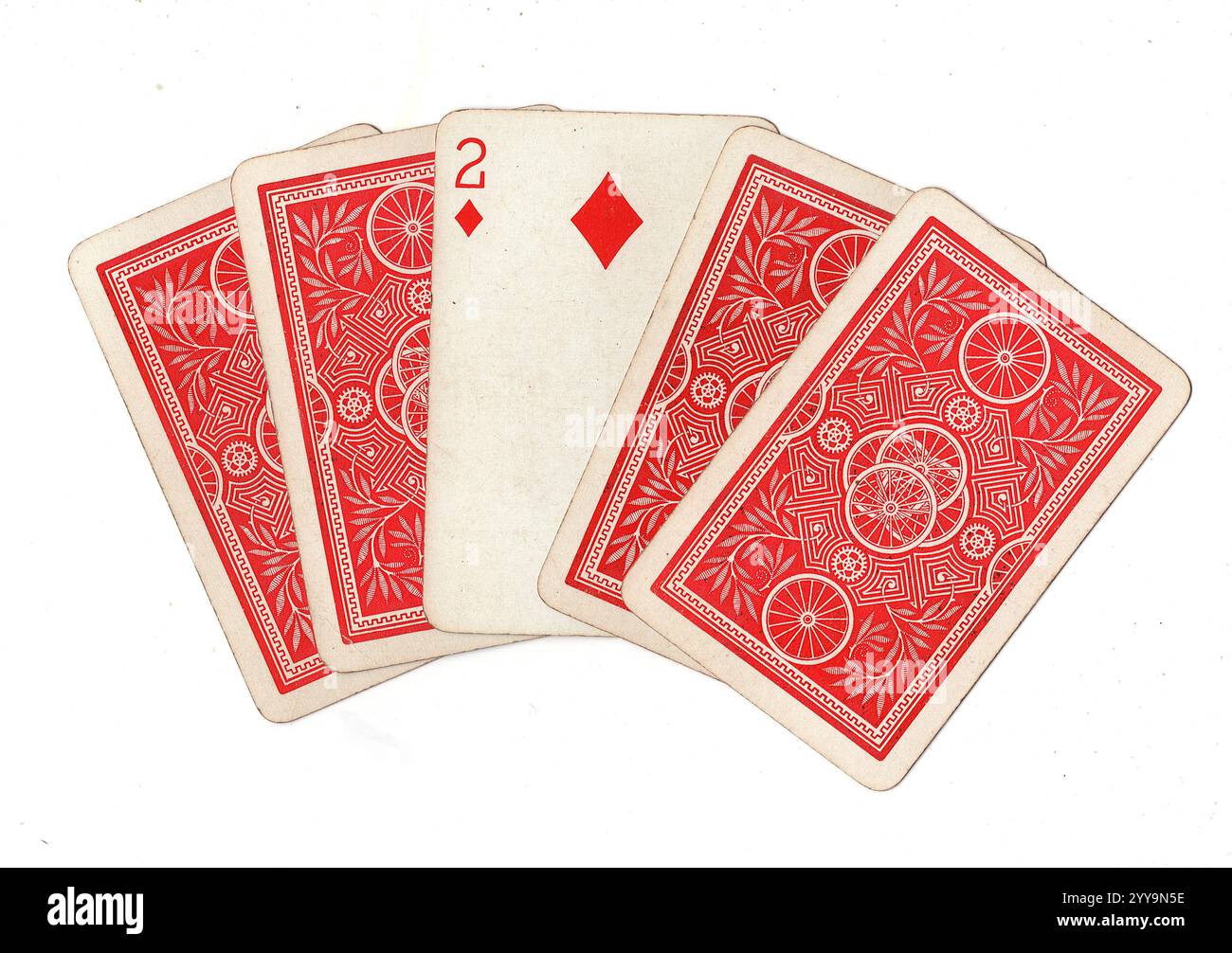 A hand of vintage playing card backs with the two of diamonds revealed ...