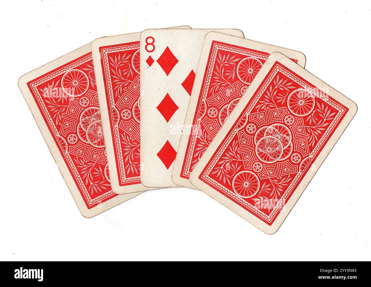 A hand of vintage playing card backs with the eight of diamonds ...