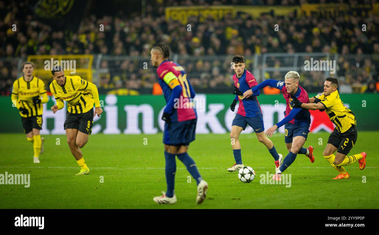Dortmund, Germany. 11th Dec 2024. Dani Olmo (Barca) Yan Couto (BvB ...