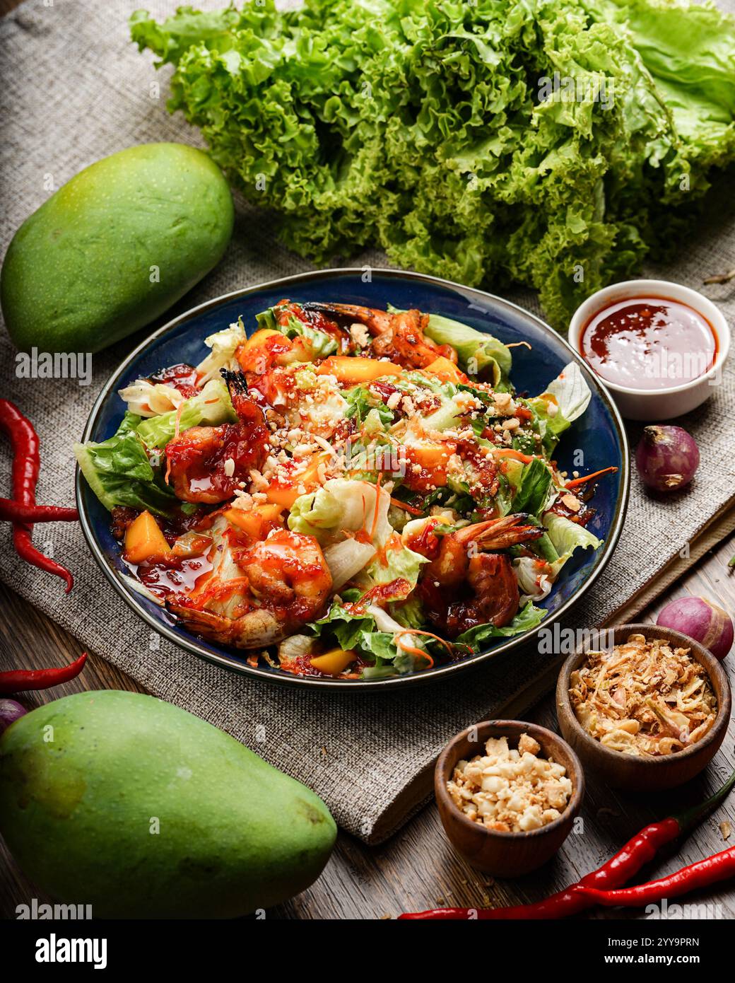Vibrant Thai-style mango shrimp salad with fresh lettuce, grilled ...