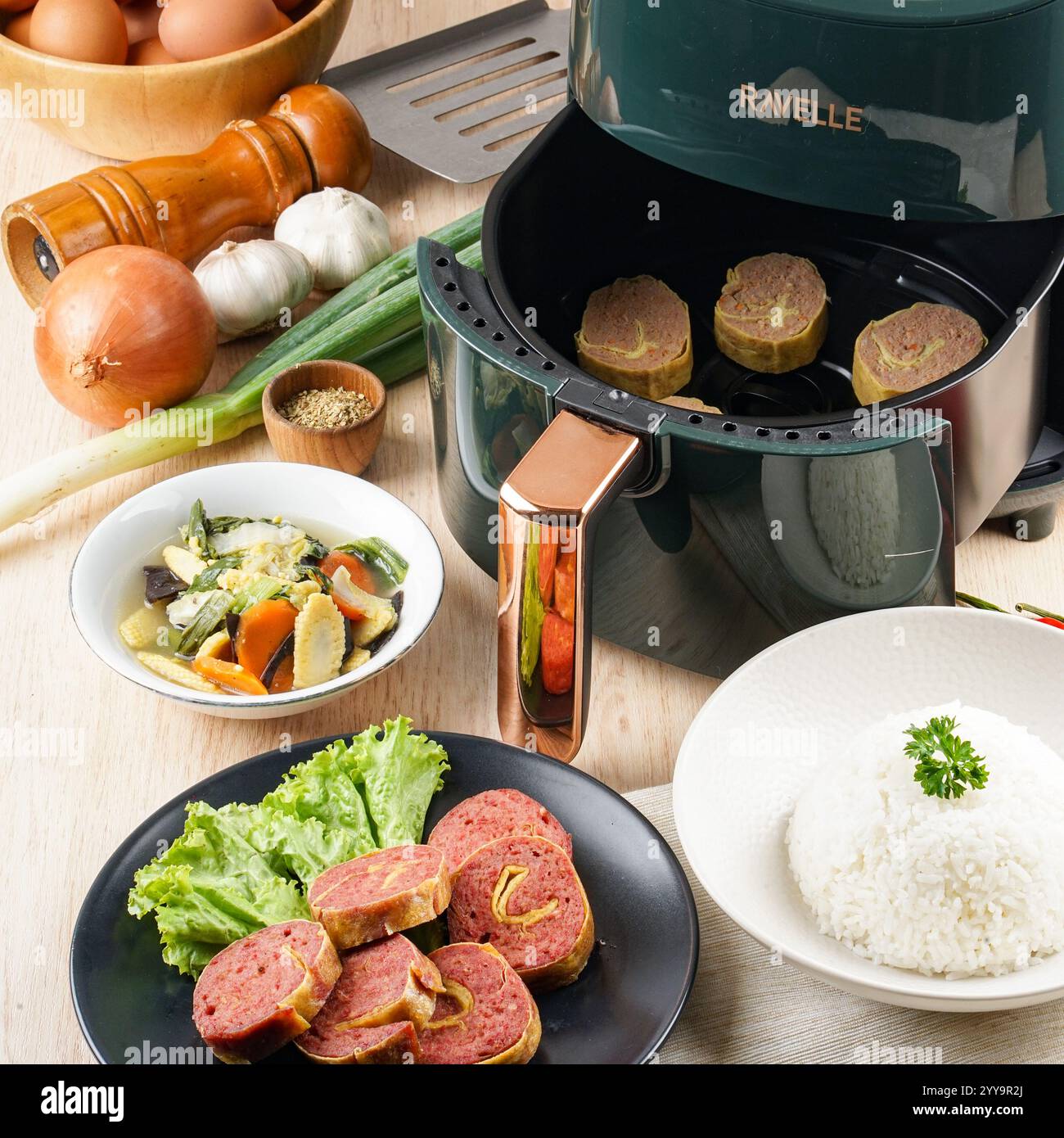 Delicious home-cooked meal featuring sliced meat rolls cooked in an air ...