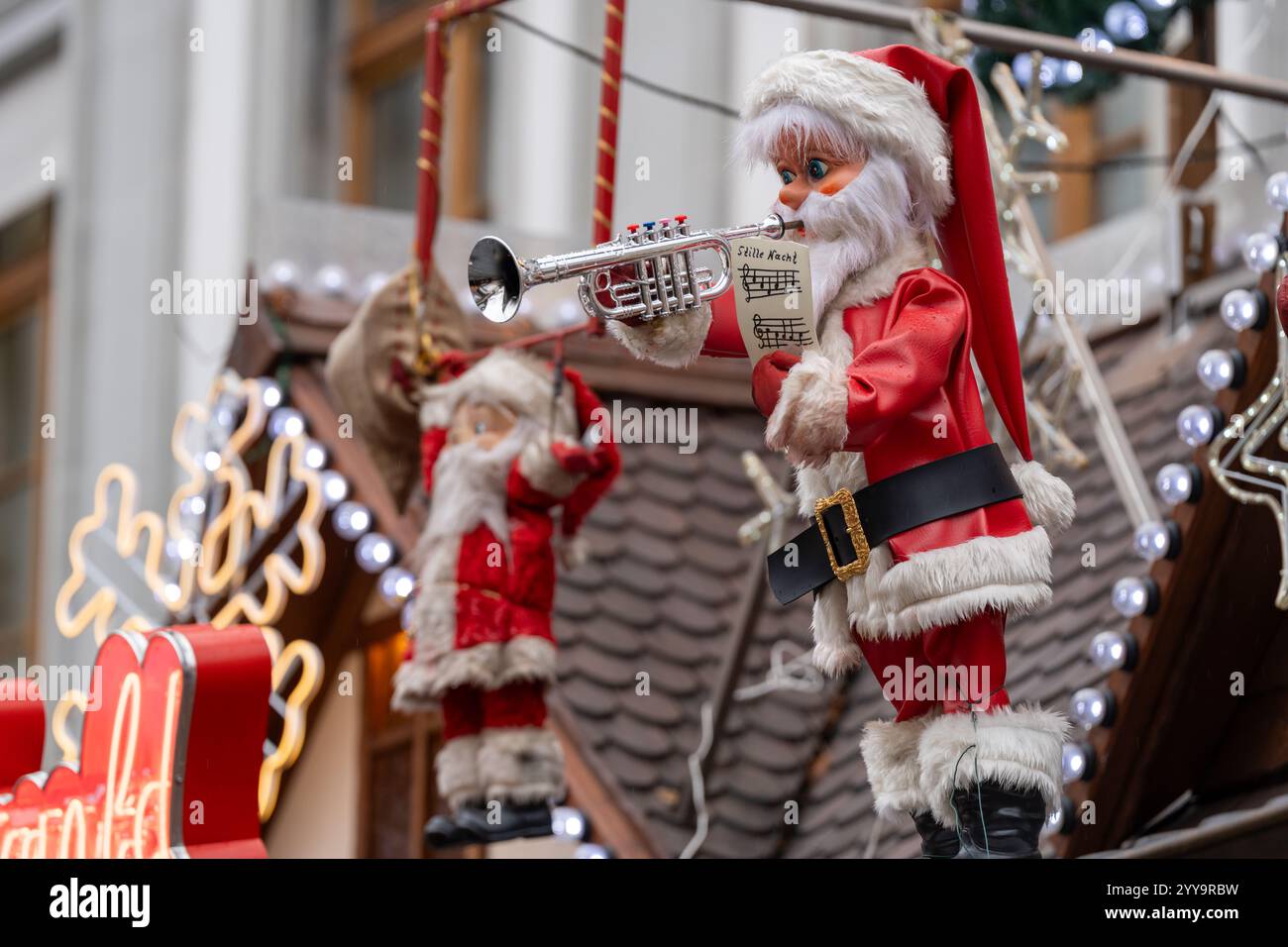 Fun Santa Claus with playing trumpt decoration at a Christmas market ...