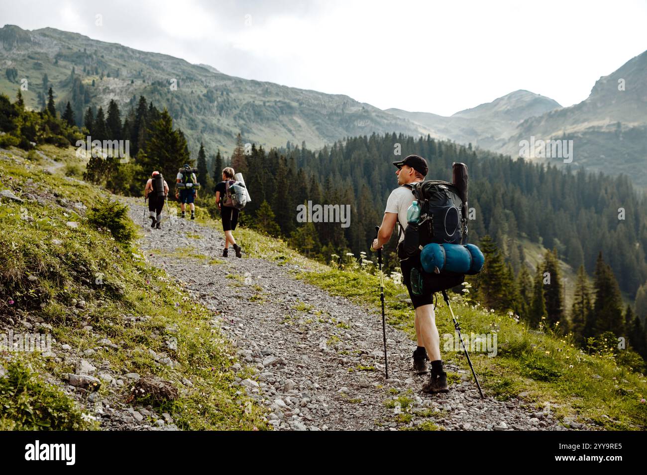 Group of Hikers with Backpacks on a Scenic Trail in Switzerland's Swiss ...