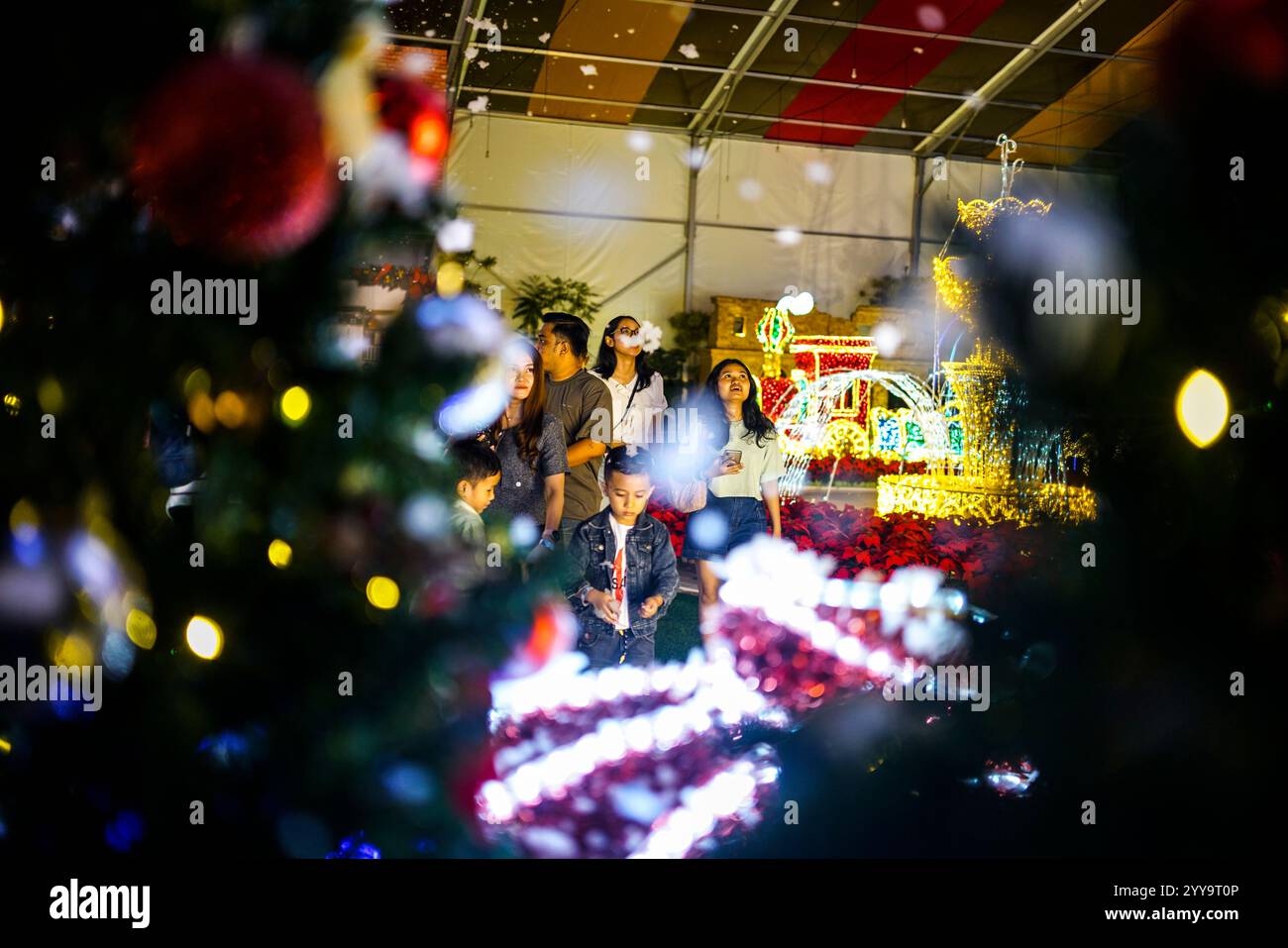 Bandung, West Java, Indonesia. 20th Dec, 2024. Visitors play with ...