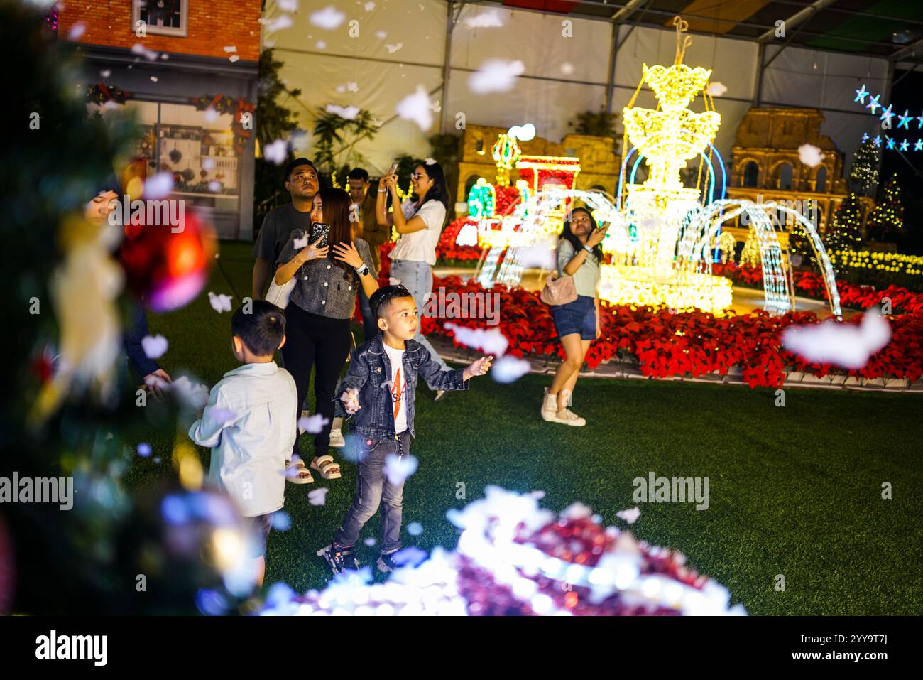 Bandung, West Java, Indonesia. 20th Dec, 2024. Visitors take a photos ...
