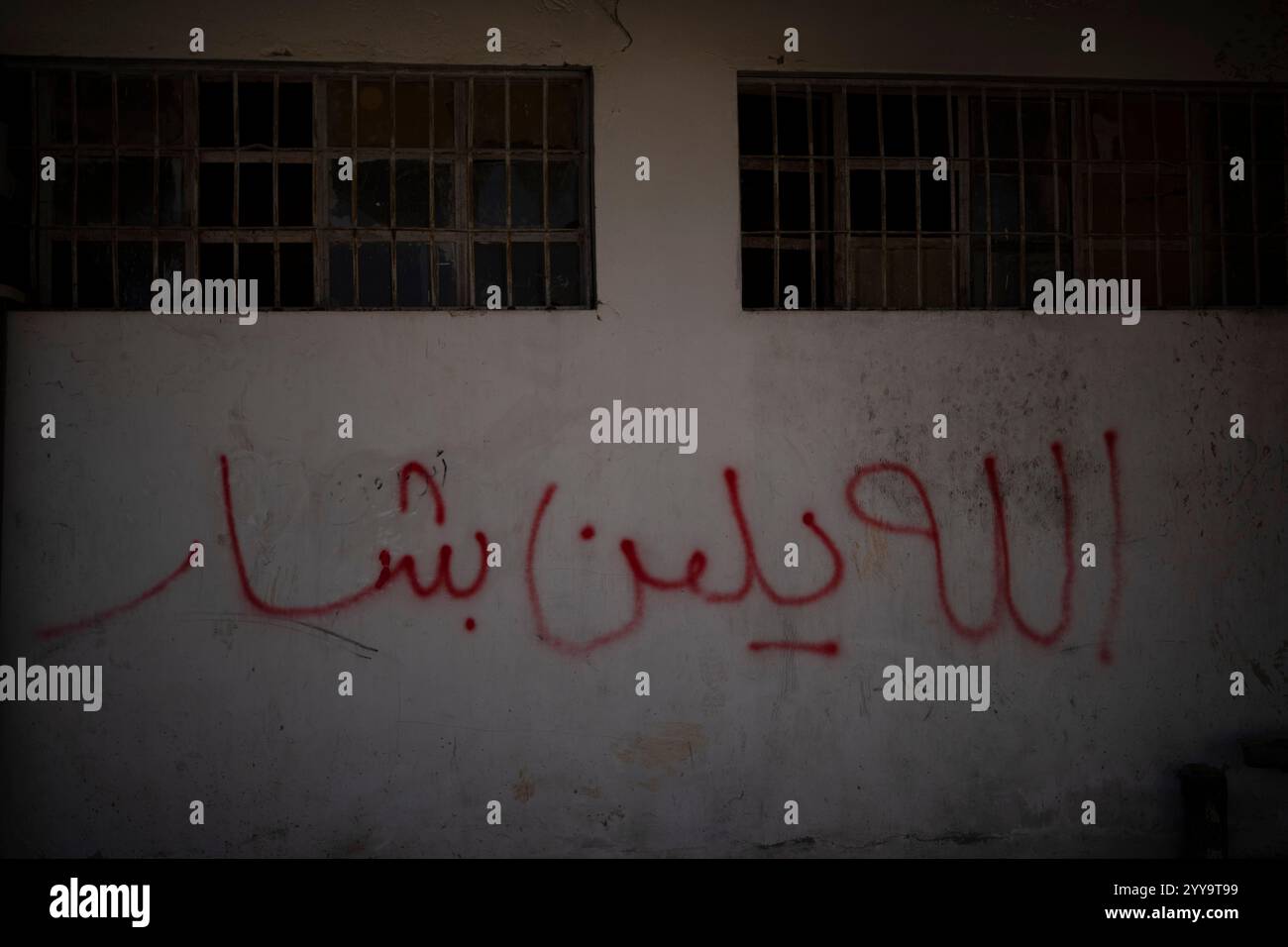 "God Damn Bashar," referring to ousted Syrian President Bashar Assad ...