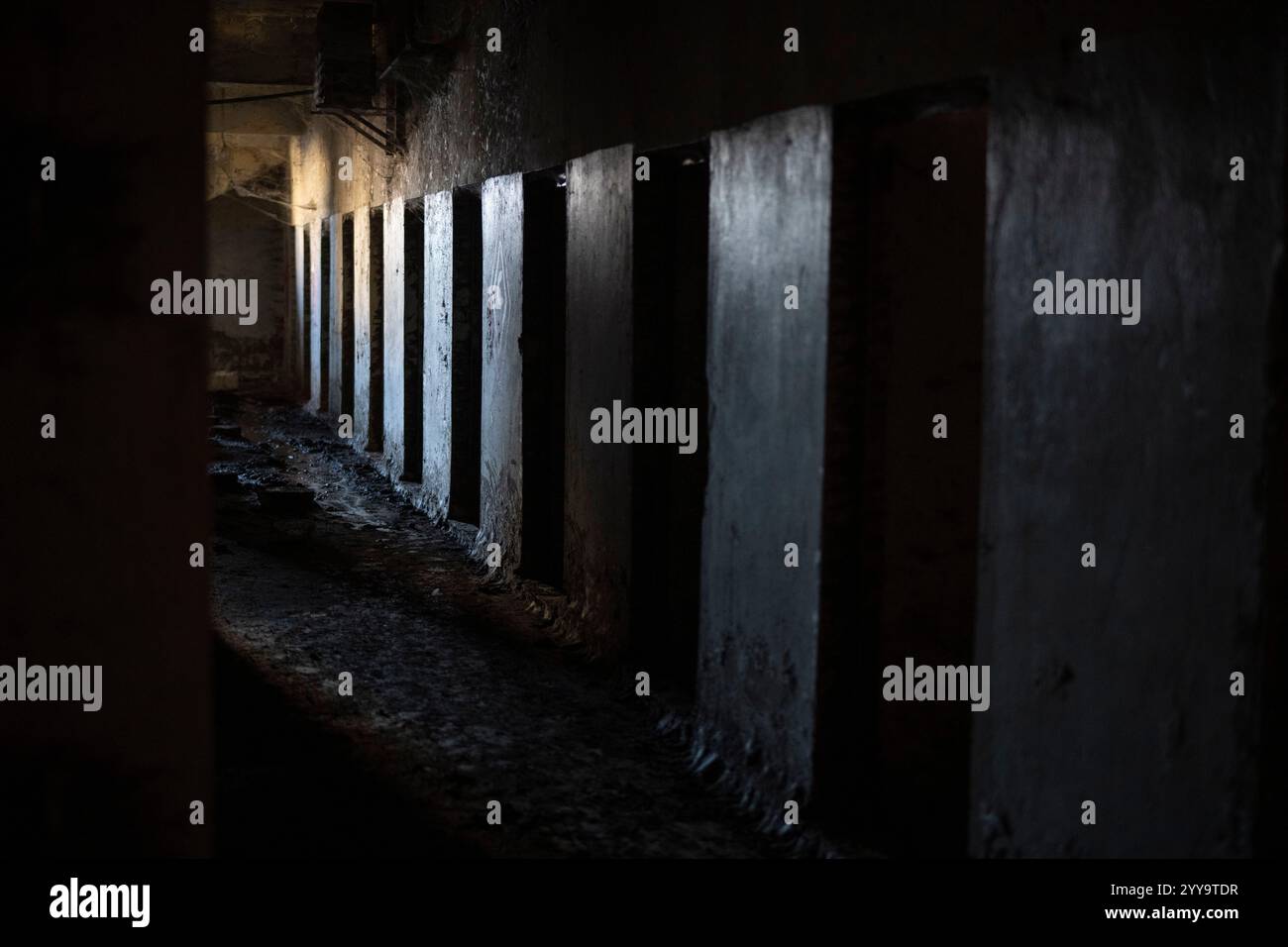 Sunlight reaches a corridor of cells in the basement of the infamous ...