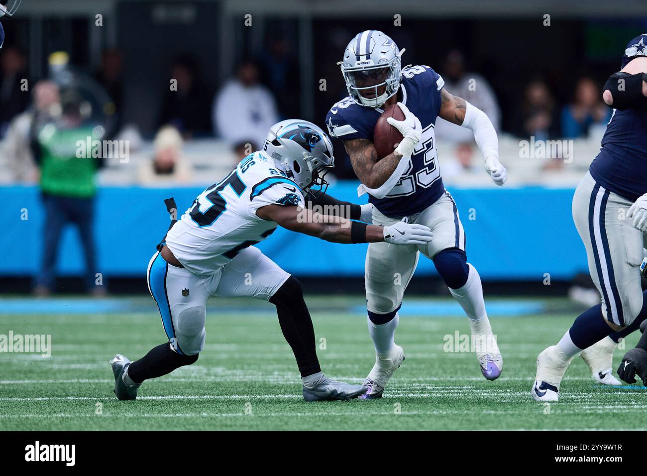 Dallas Cowboys running back Rico Dowdle (23) tries to run through the ...