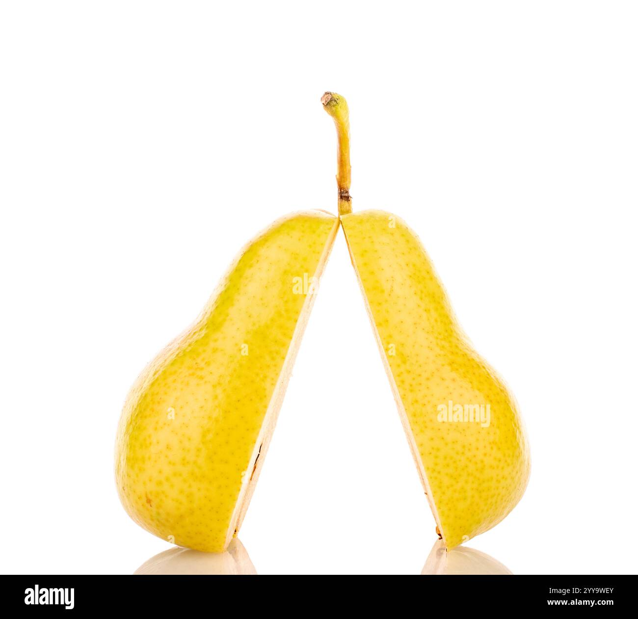 One cut yellow ripe pear, close-up, isolated on white background Stock ...