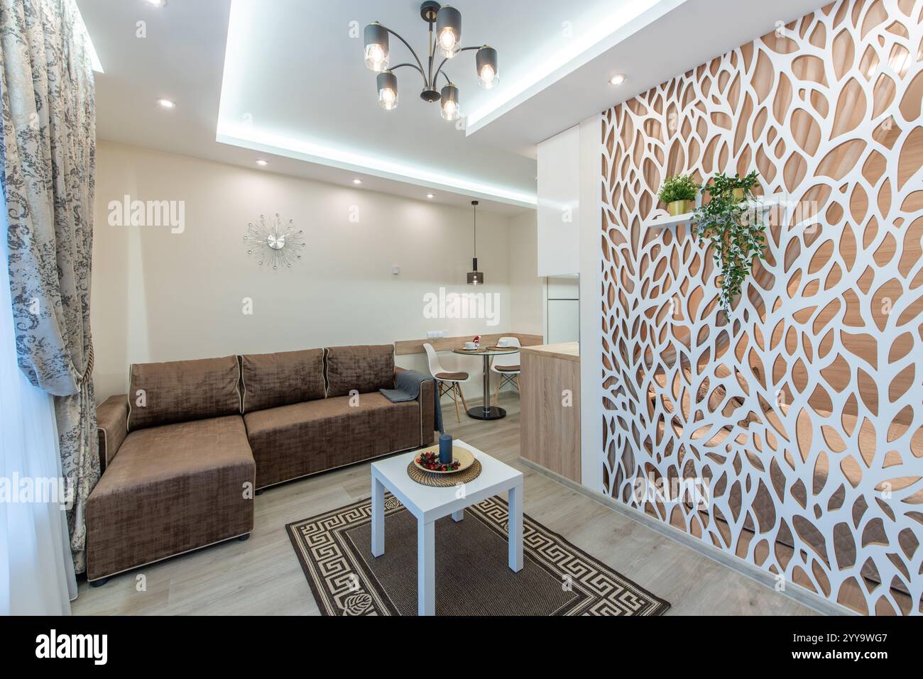 Stylish home interior featuring a cozy living room, contemporary lighting, and an intricate ...