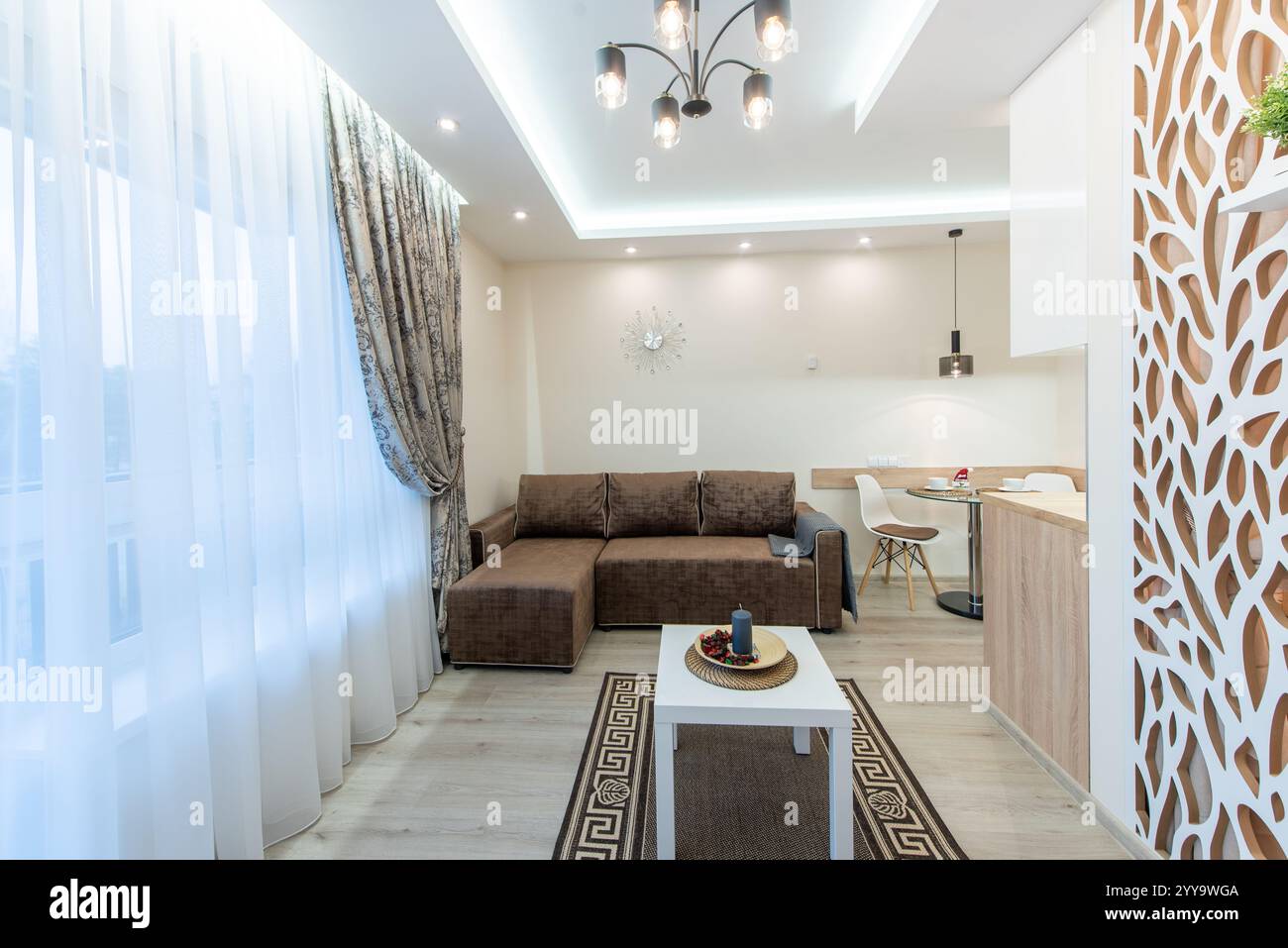 Stylish home interior featuring a cozy living room, contemporary lighting, and an intricate ...