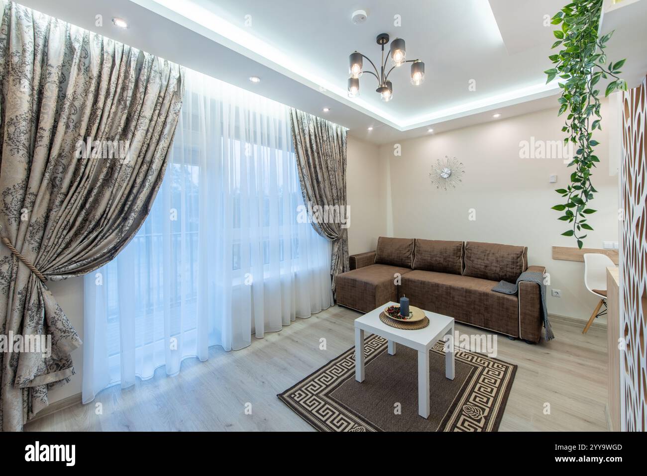 Stylish home interior featuring a cozy living room, contemporary ...