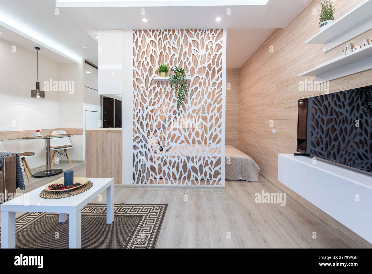 Stylish home interior featuring a cozy living room, contemporary lighting, and an intricate ...