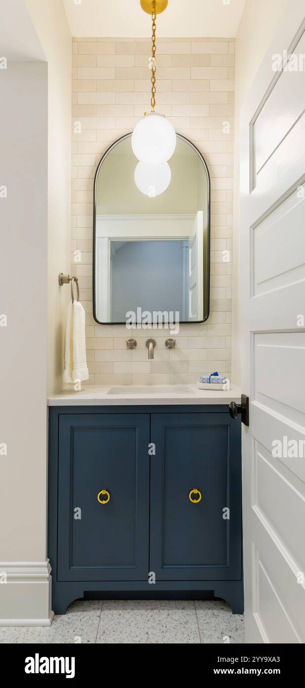 Powder room with dark blue vanity Stock Photo - Alamy