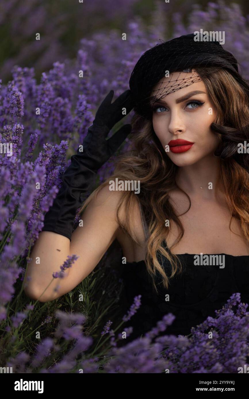 Beautiful girl is wearing fashion dress at field of lavender. Provence ...