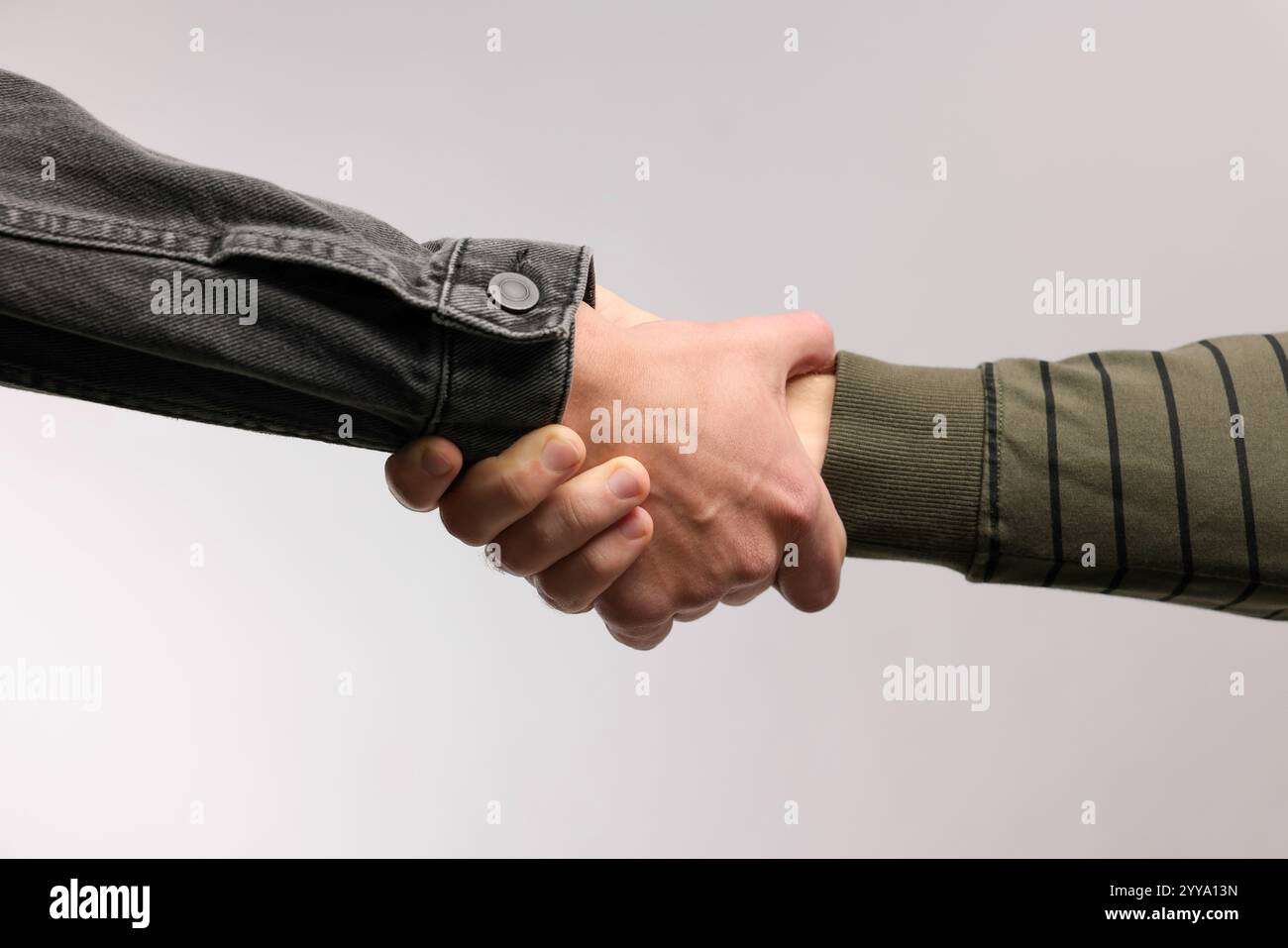 Help and support. People holding hand on light grey background, closeup ...