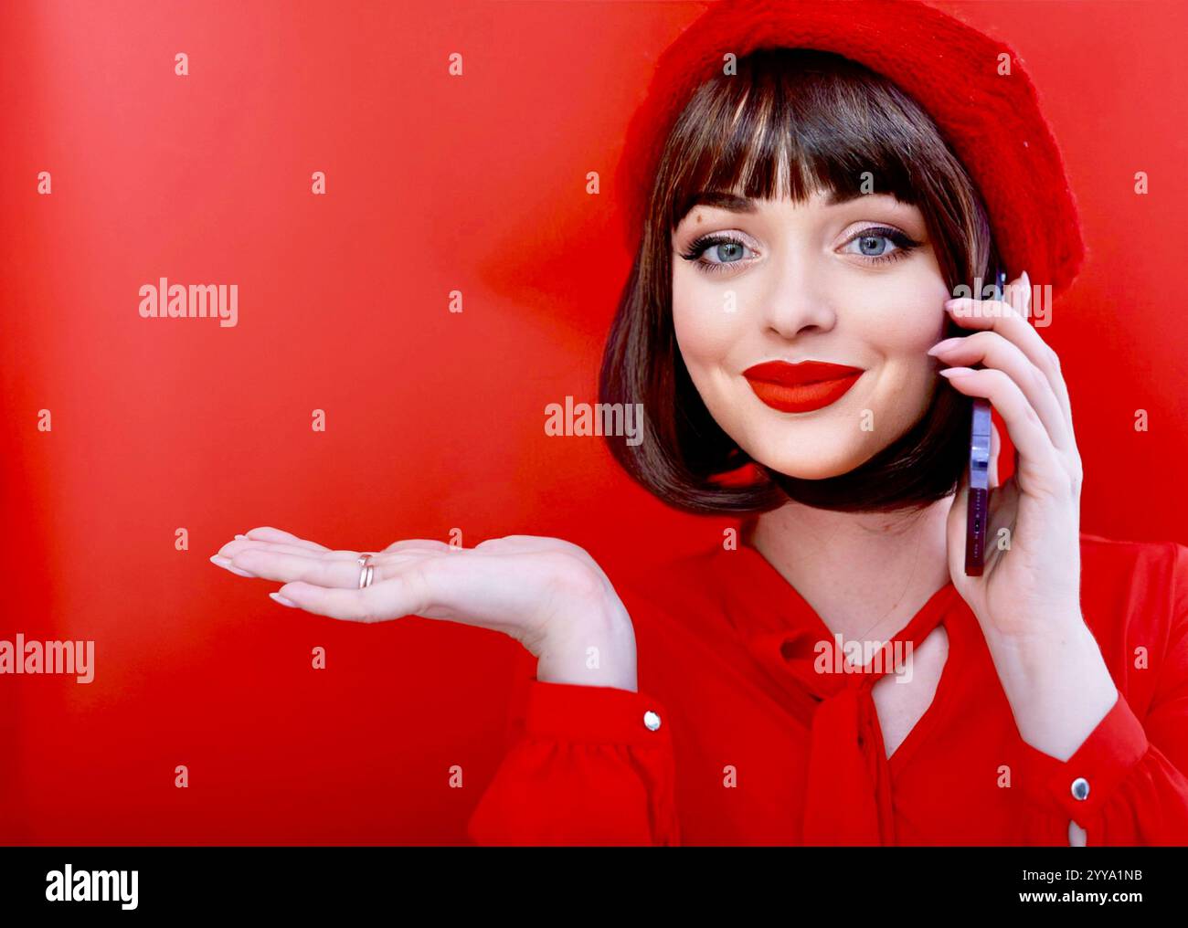 a girl with a bob hairstyle is holding a bilge in her hands. The girl ...