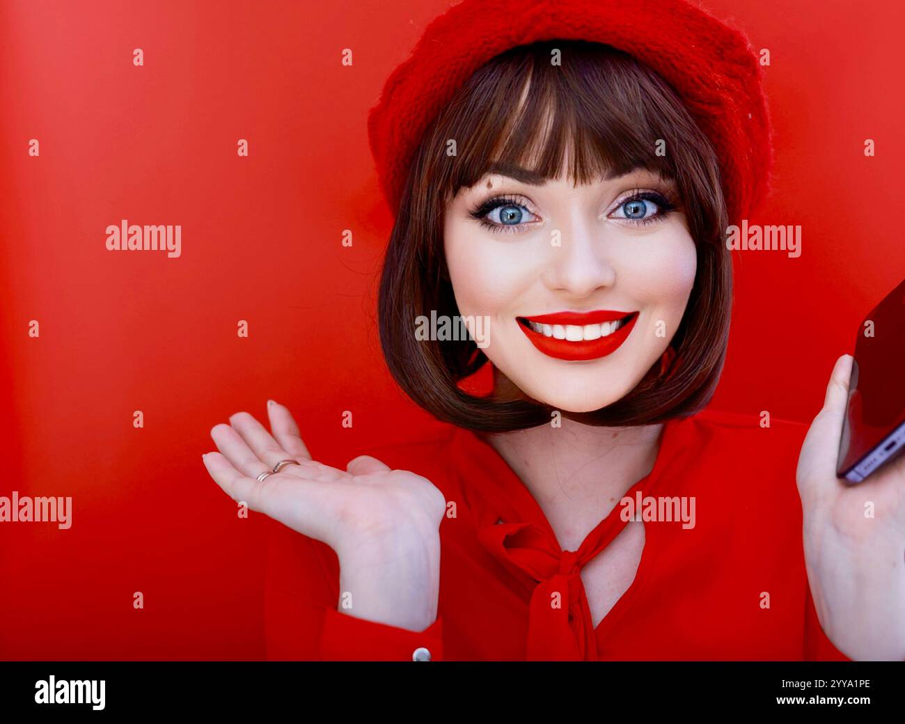 a girl with a bob hairstyle is holding a bilge in her hands. The girl ...