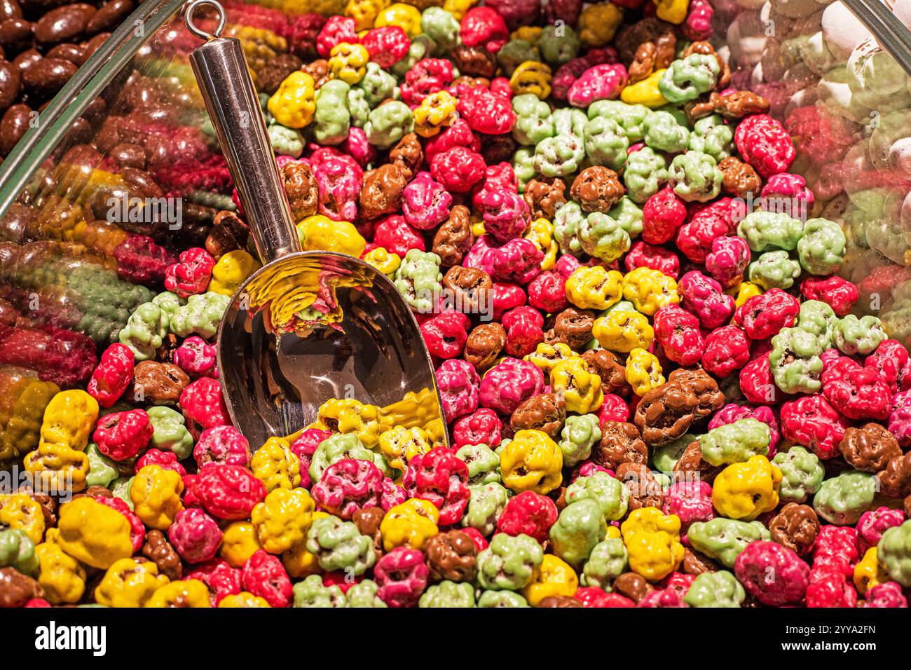 background of multi-colored candies with raisins in the shape of a ...