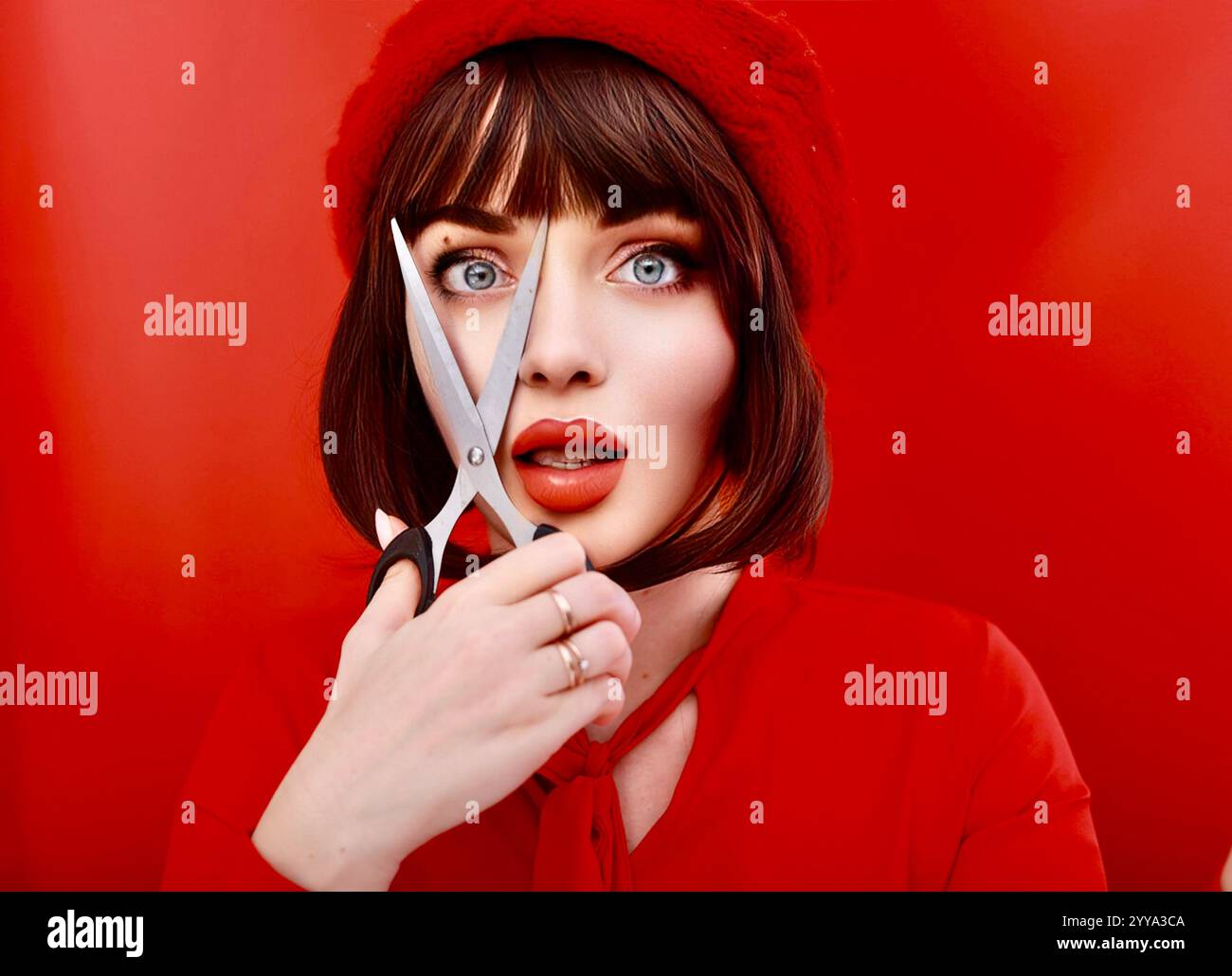 Haircut. Portrait of young woman hairdresser cutting hair with scissors ...