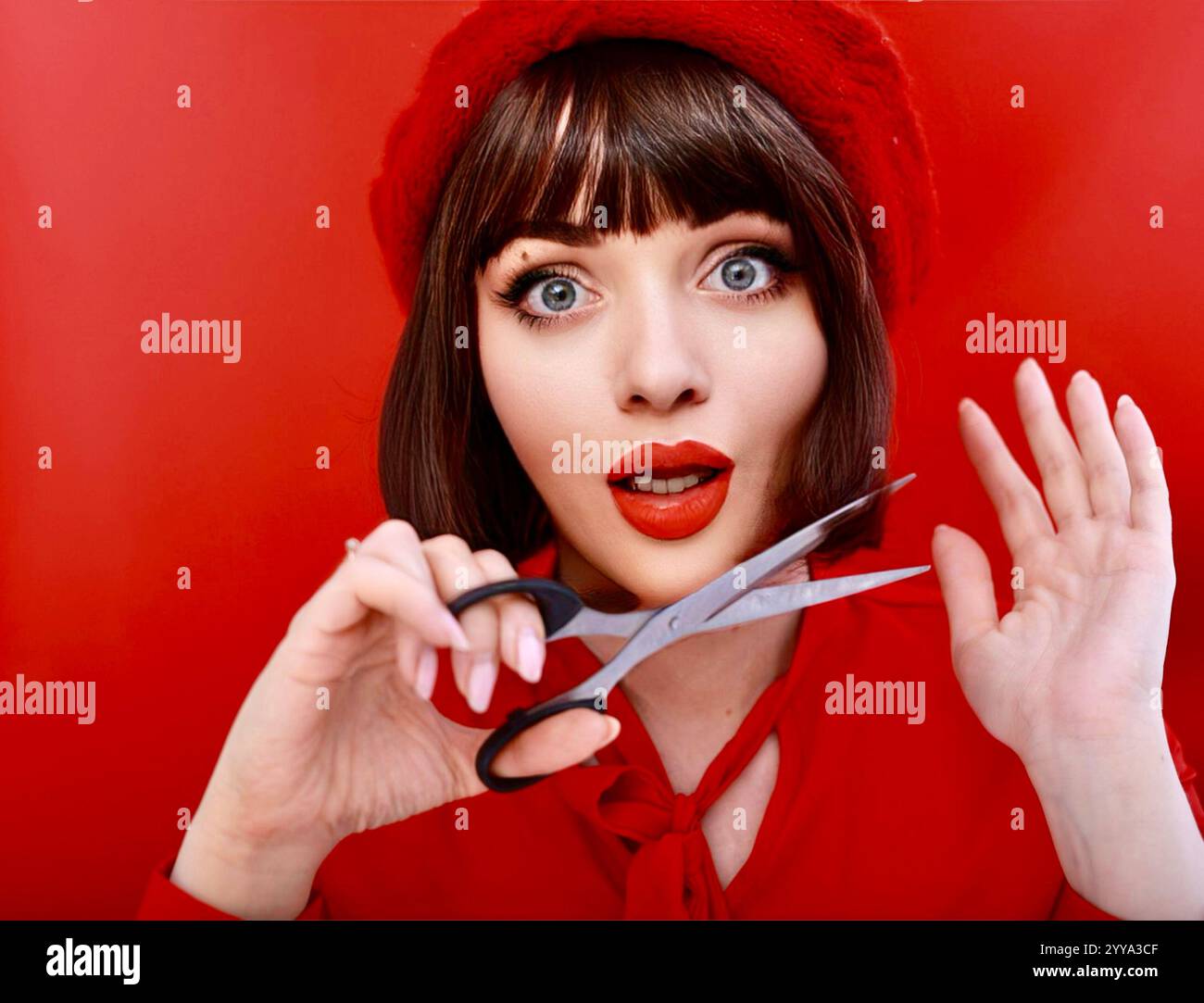 Haircut. Portrait of young woman hairdresser cutting hair with scissors ...
