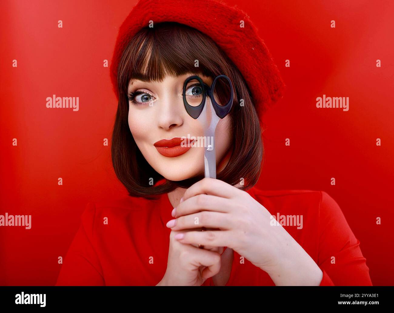 Haircut. Portrait of young woman hairdresser cutting hair with scissors ...