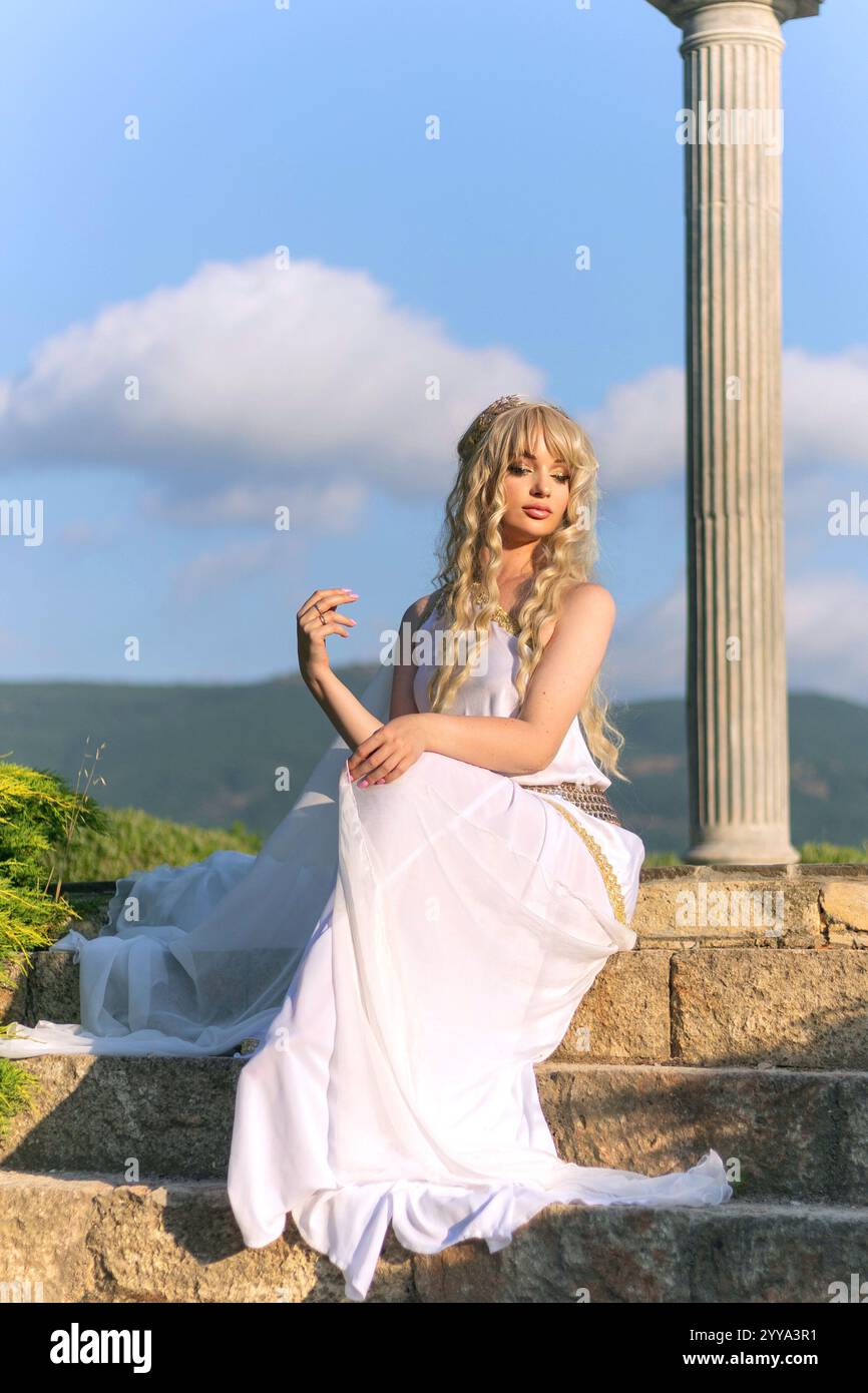 Greek goddess at ancient city ruins. Beautiful young woman Aphrodite ...