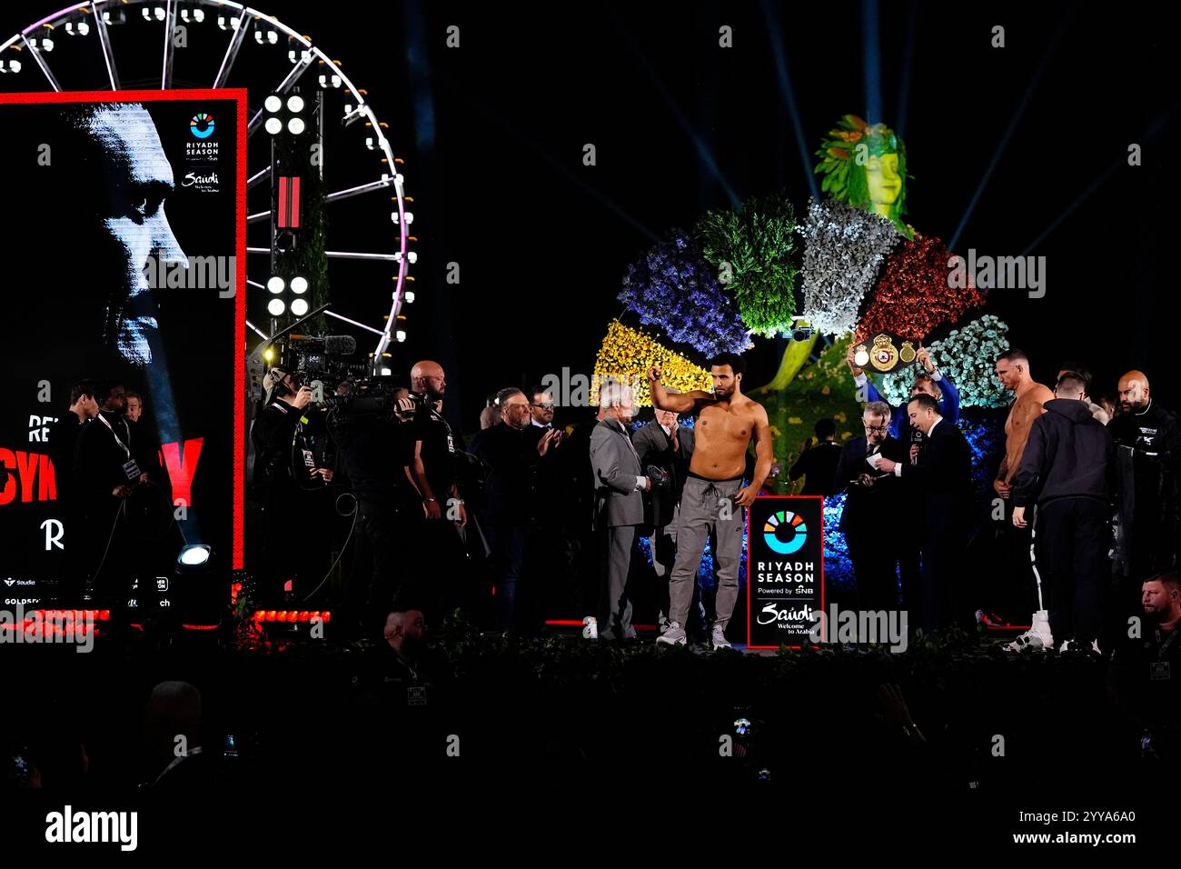 Moses Itauma (centre right) during a weigh-in in Riyadh. Tyson Fury and ...
