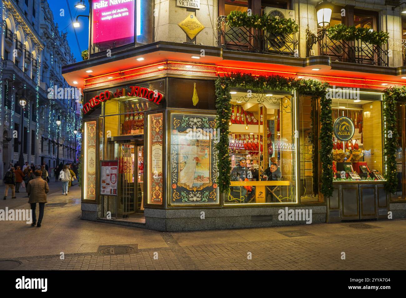 Museo del Jamon, shop selling spanish ham, restaurant at night in ...