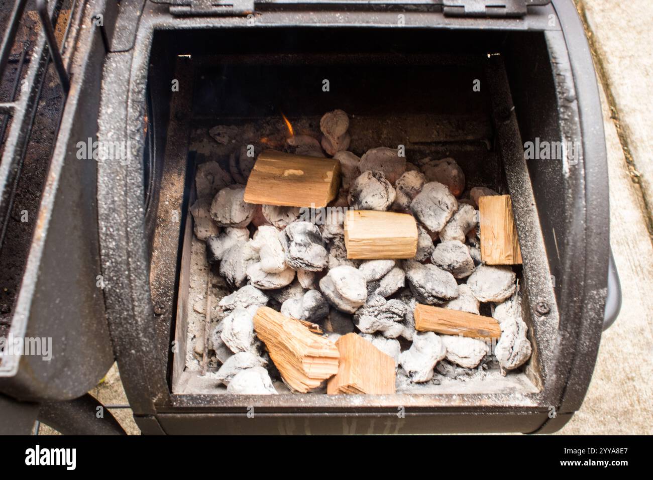 Charcoal with fire ready to cook food in a small grill Stock Photo - Alamy