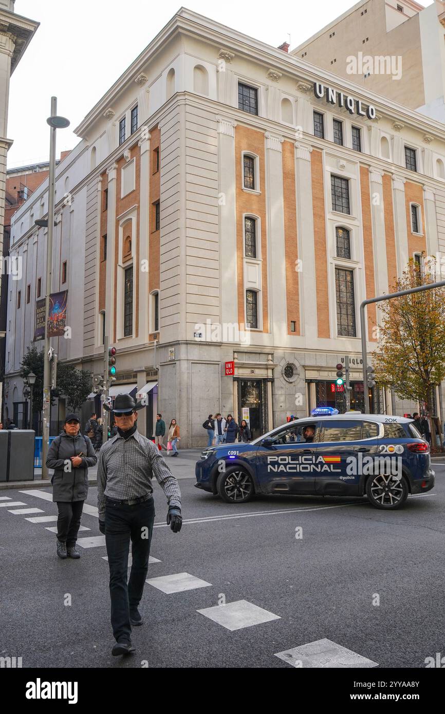 Uniqlo Closing company building at Gran via, Police car in front ...