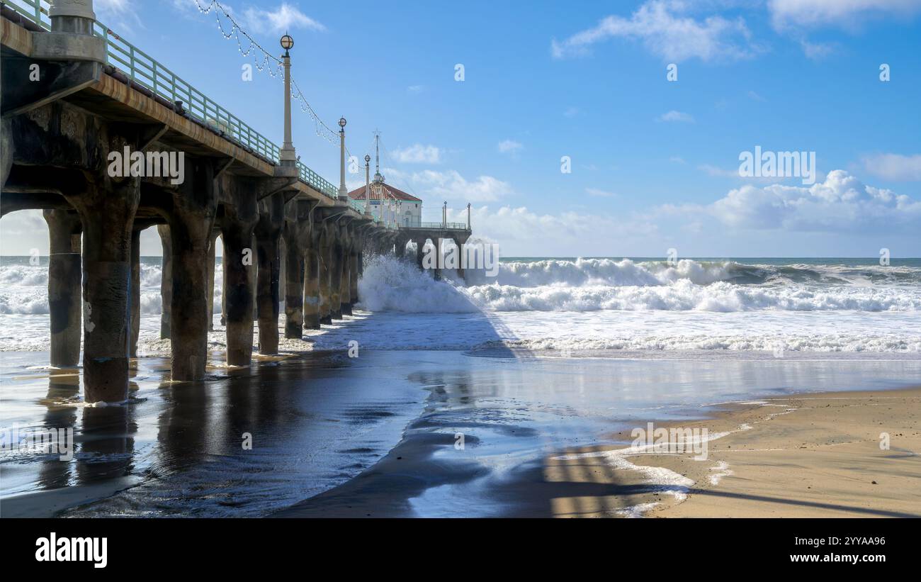 Large waves crash into the Manhattan Beach pier in Los Angeles ...
