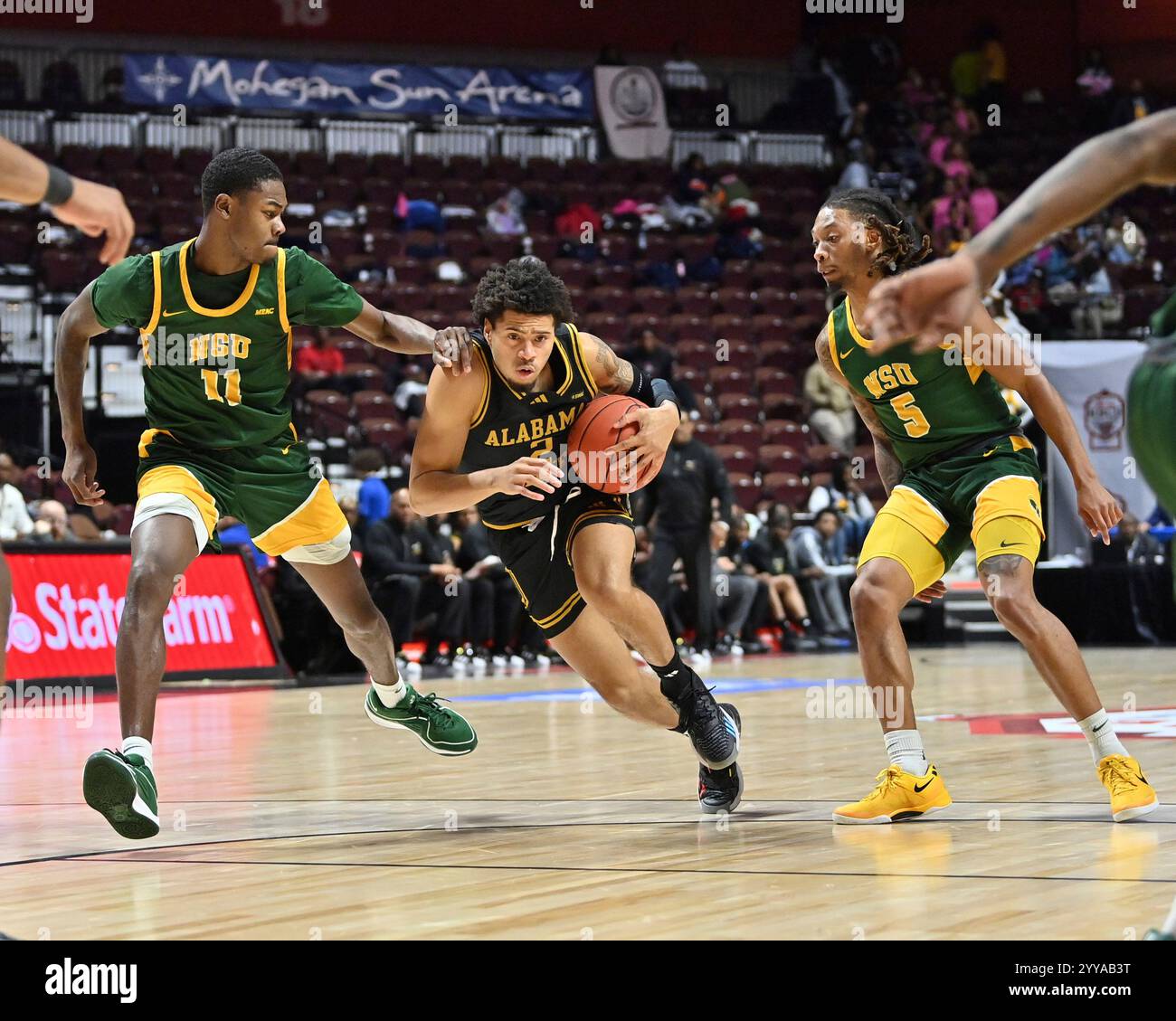 UNCASVILLE, CT - DECEMBER 19: Alabama State Hornets guard Micah Simpson (2) splits the double ...