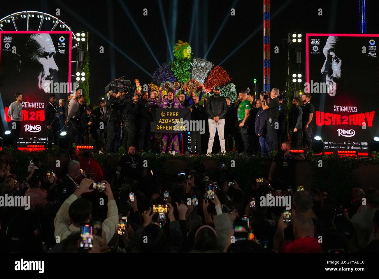 Boxers Britain's Tyson Fury, center right, and world champion Ukraine's ...