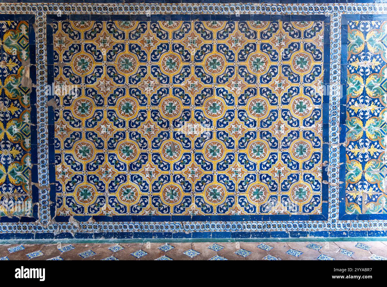 Ornamental colourful geometric medieval ceramic tiles of walls in old ...