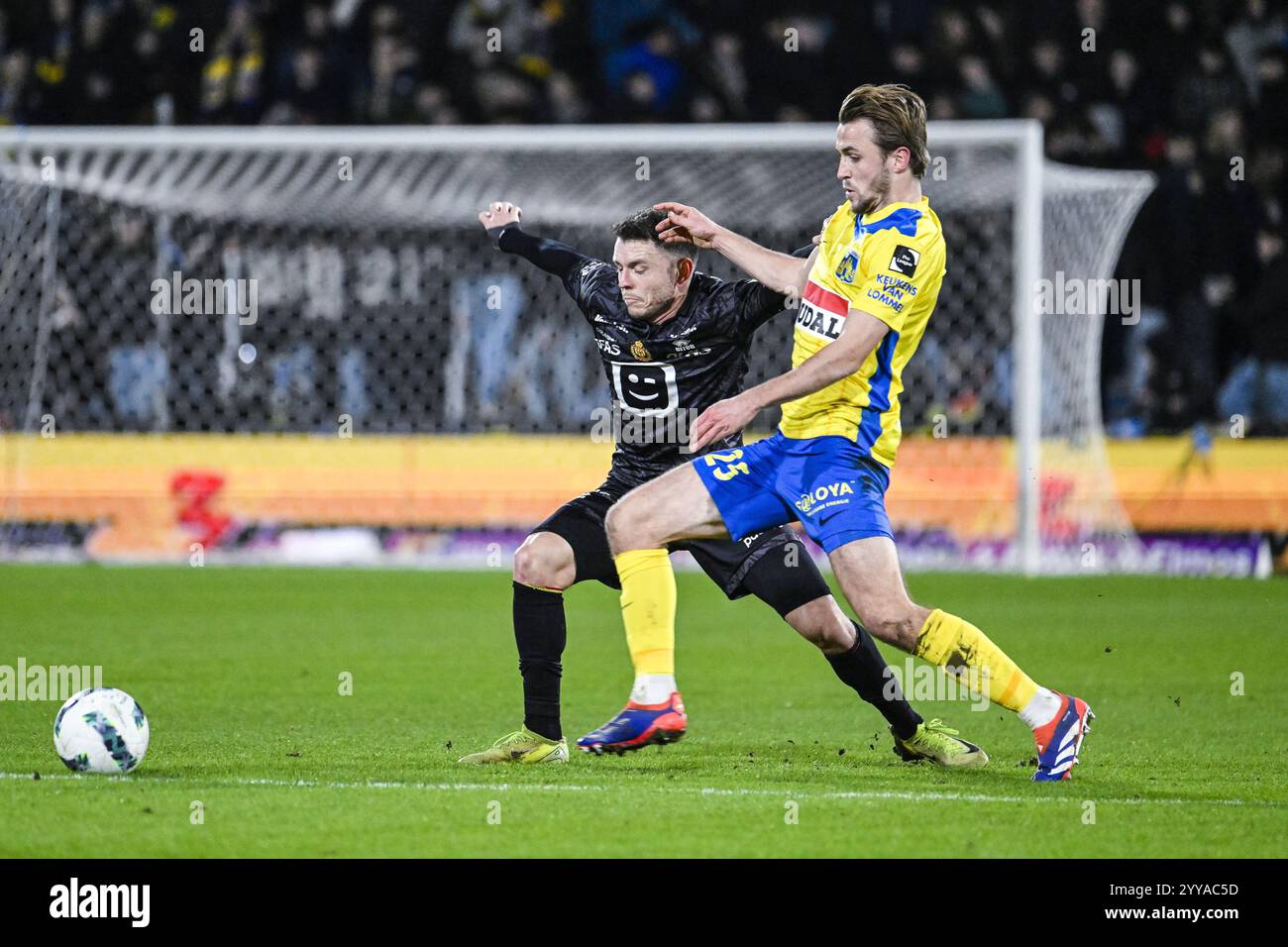 Westerlo, Belgium. 20th Dec, 2024. Mechelen's Kerim Mrabti and Westerlo ...