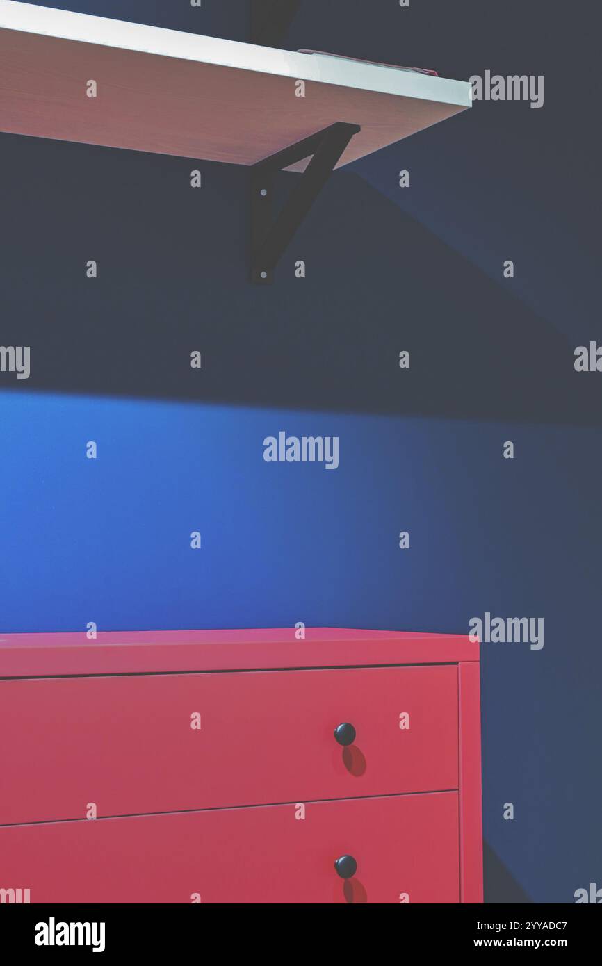 A red pedestal near a blue wall. Bright colors in the interior Stock ...