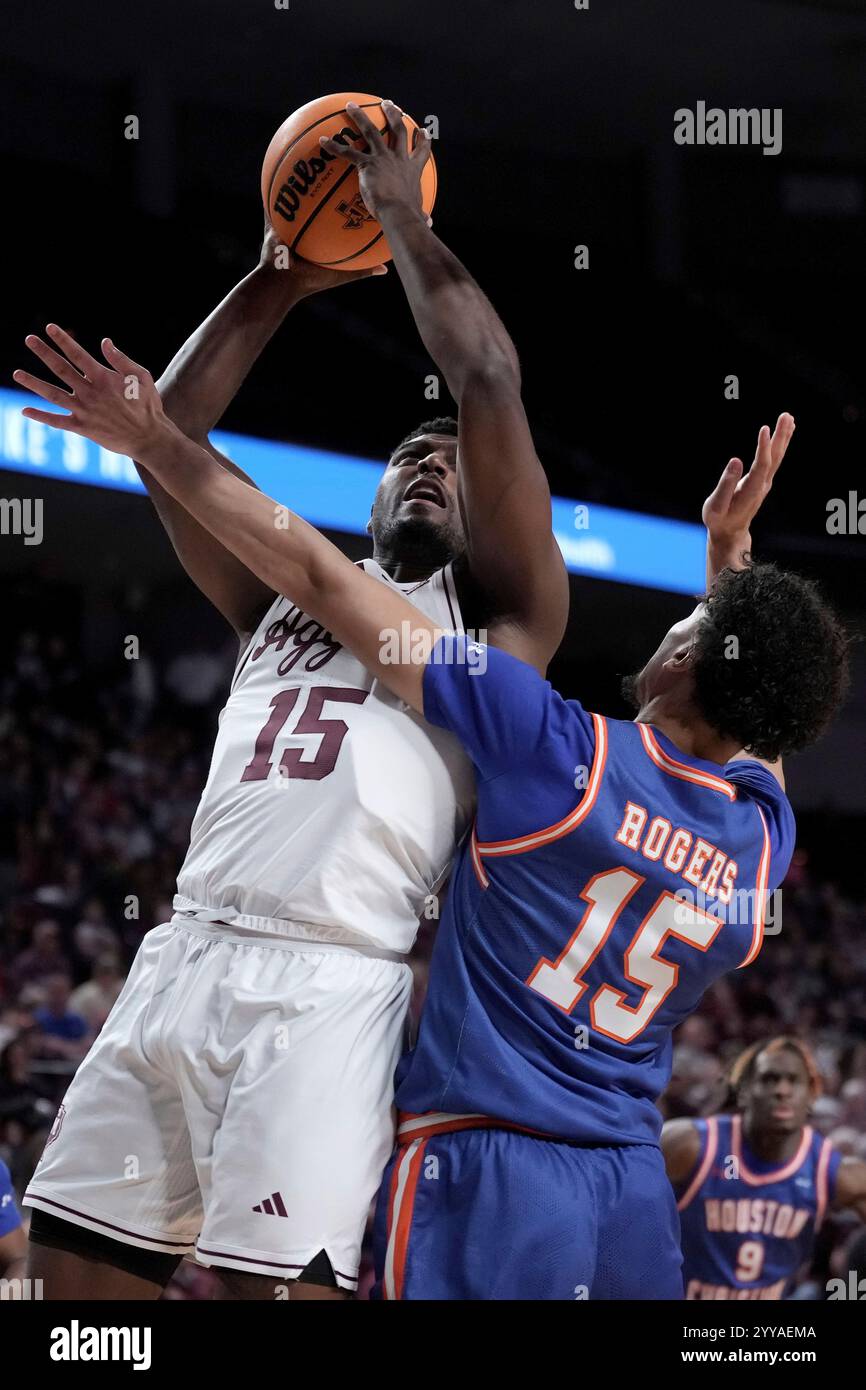 Texas A&M forward Henry Coleman III (15) makes a layup past Houston Christian forward Peyton ...