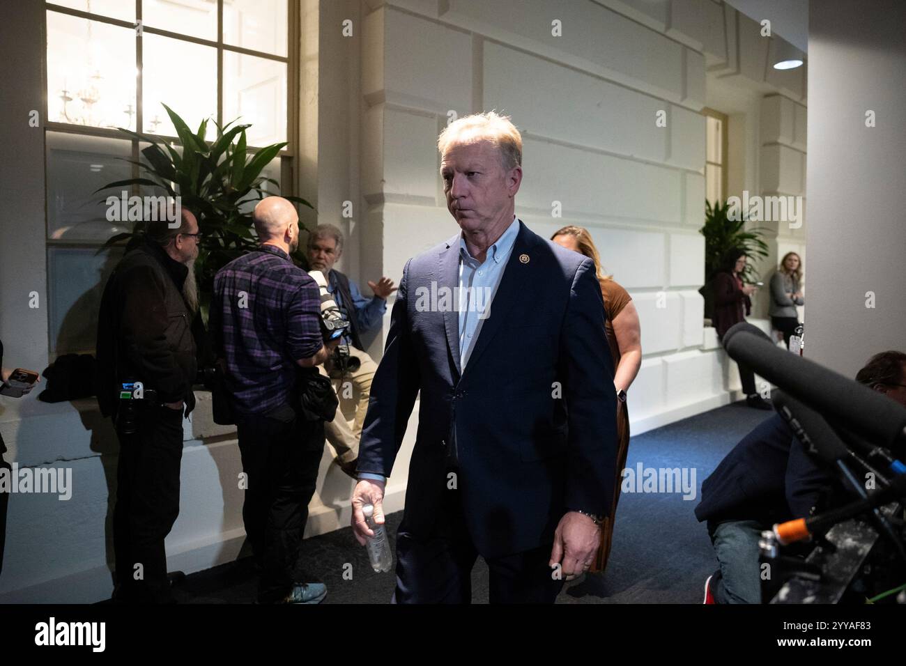 Rep. Kevin Hern (R-Okla.) departs a House Republican Conference meeting ...