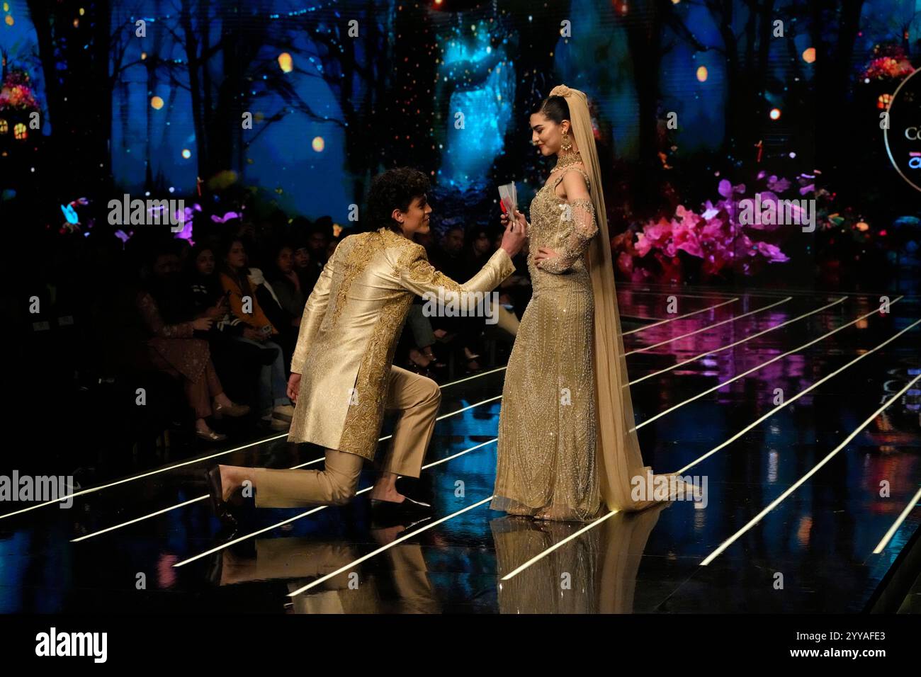 Models present creations from designer Parishae for Amir Adnan during a ...