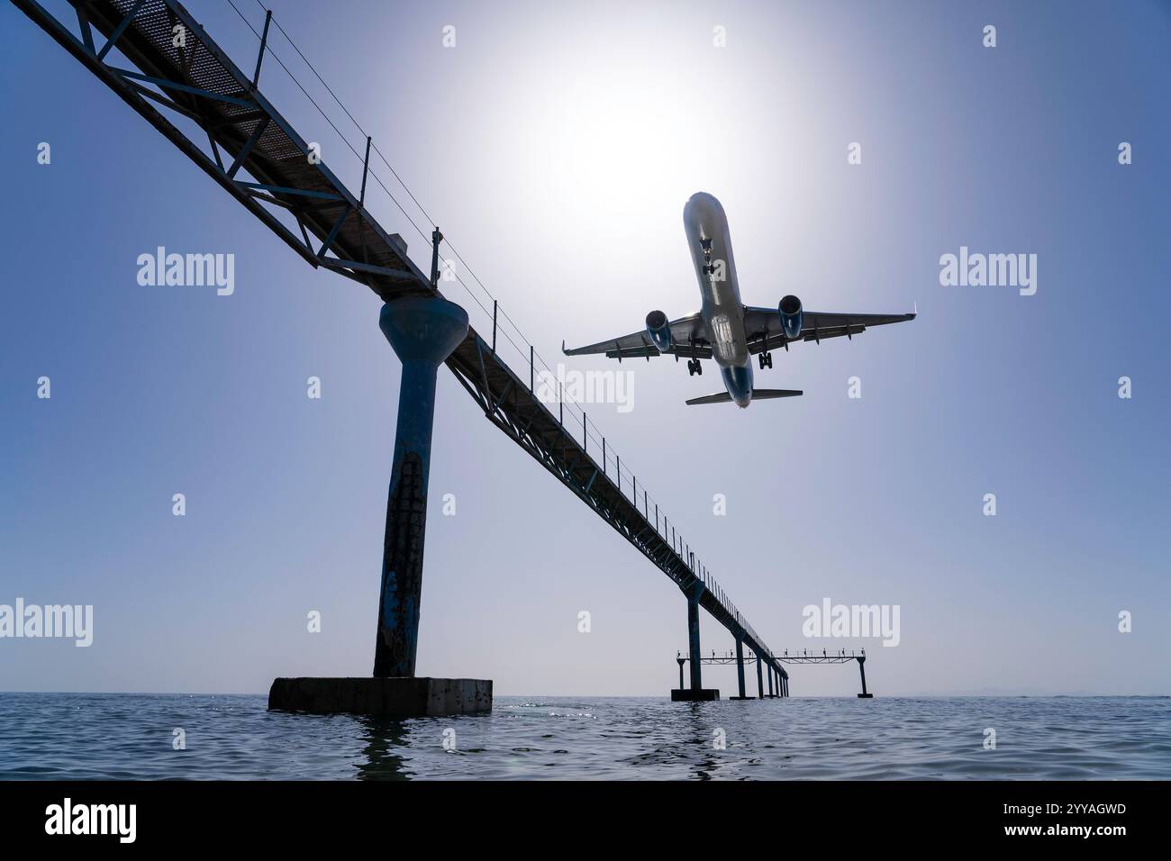Airplane approaching over oceanic beach hi-res stock photography and ...